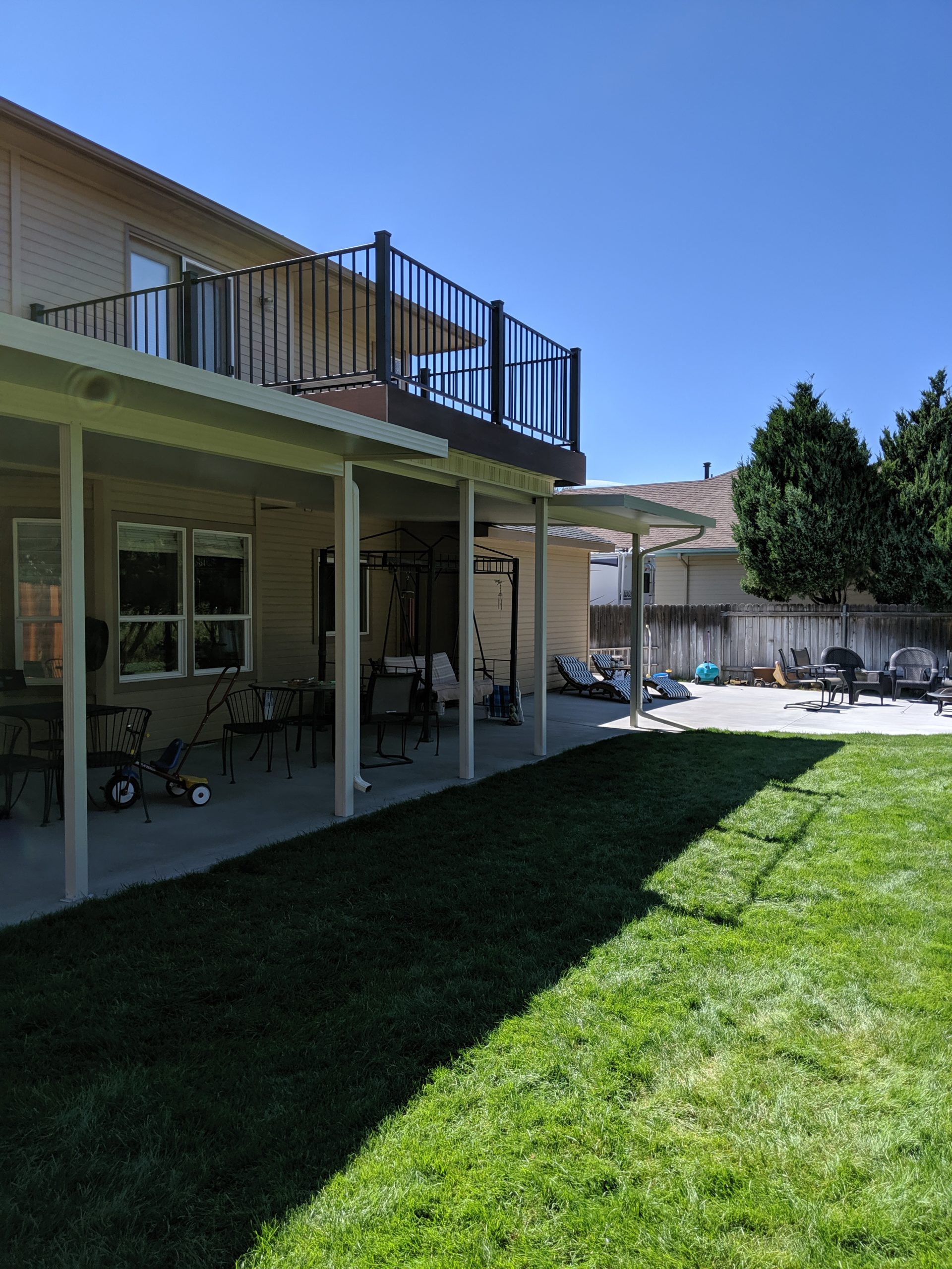 Patio Cover with Balcony addition on Idaho Falls home - Sharp Exteriors